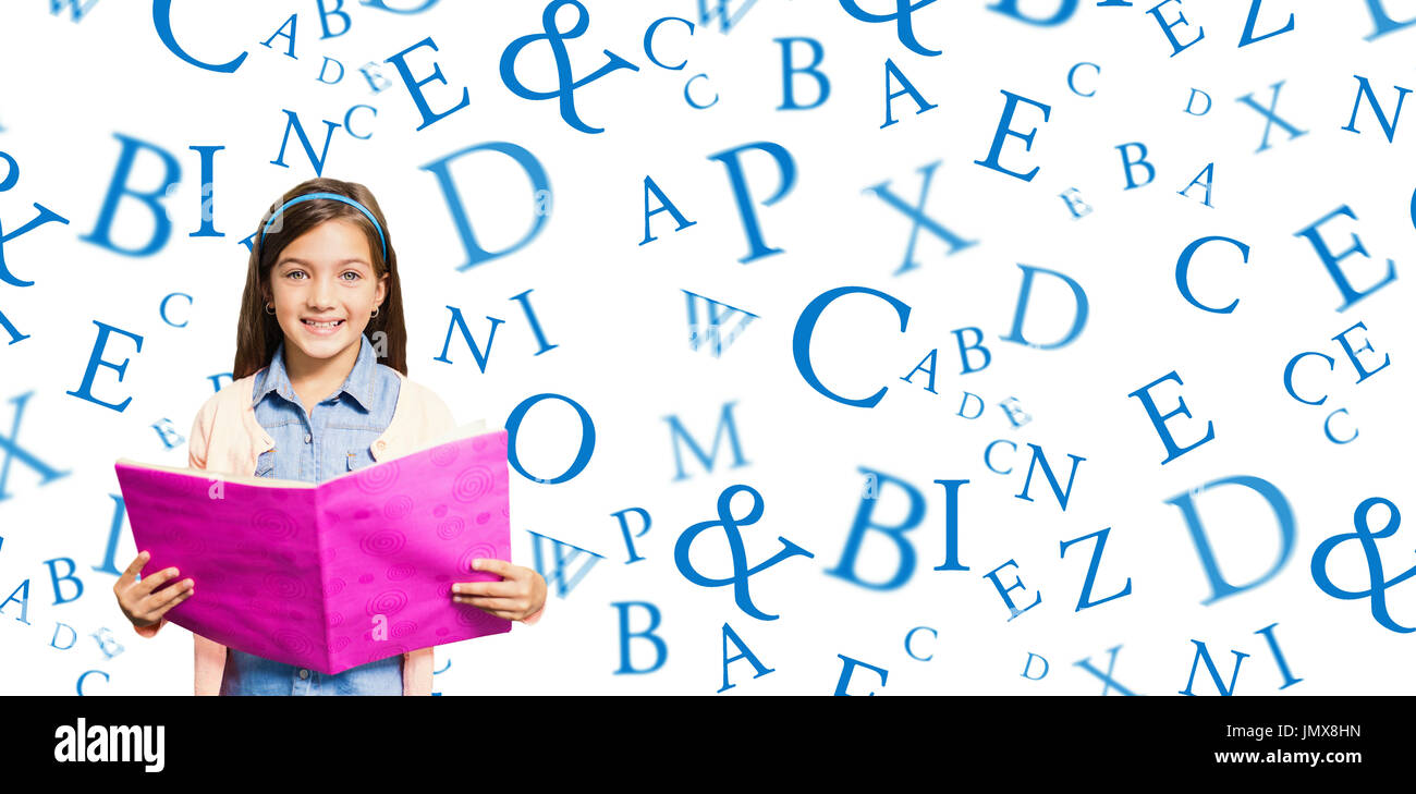 Portrait of girl holding pink book against letters Stock Photo - Alamy