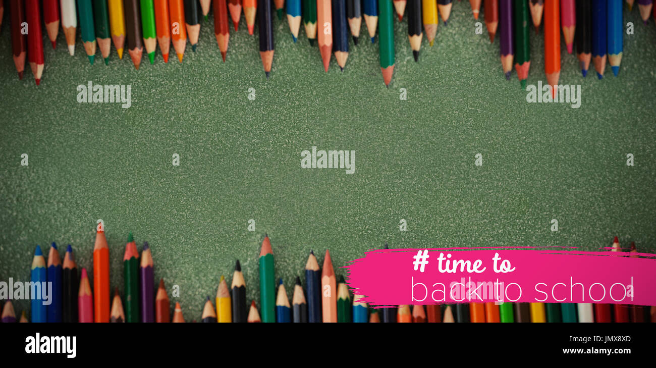 Back to school text with hashtag against overhead view of colored ...