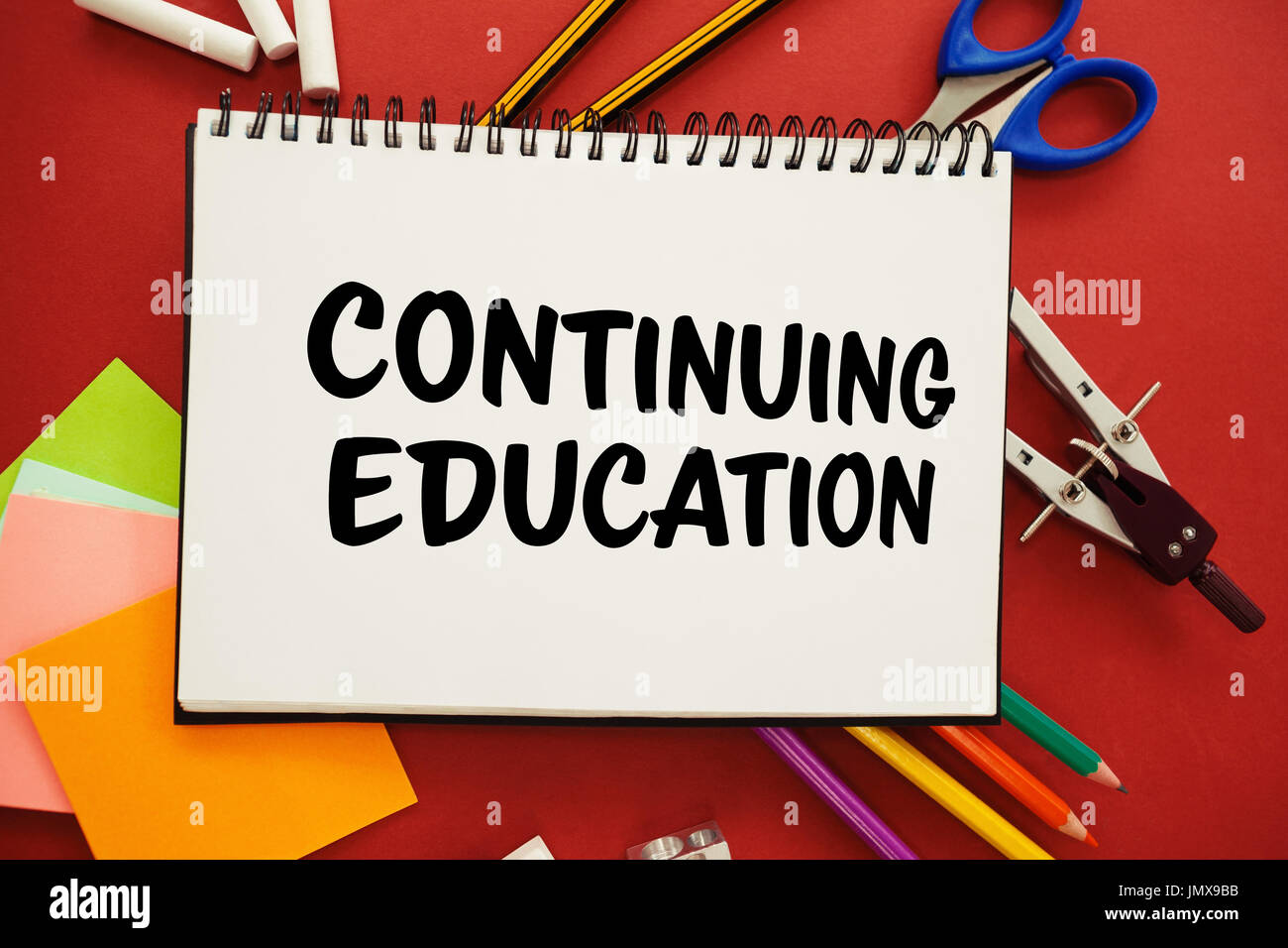 Continuing education text against white background against overhead ...