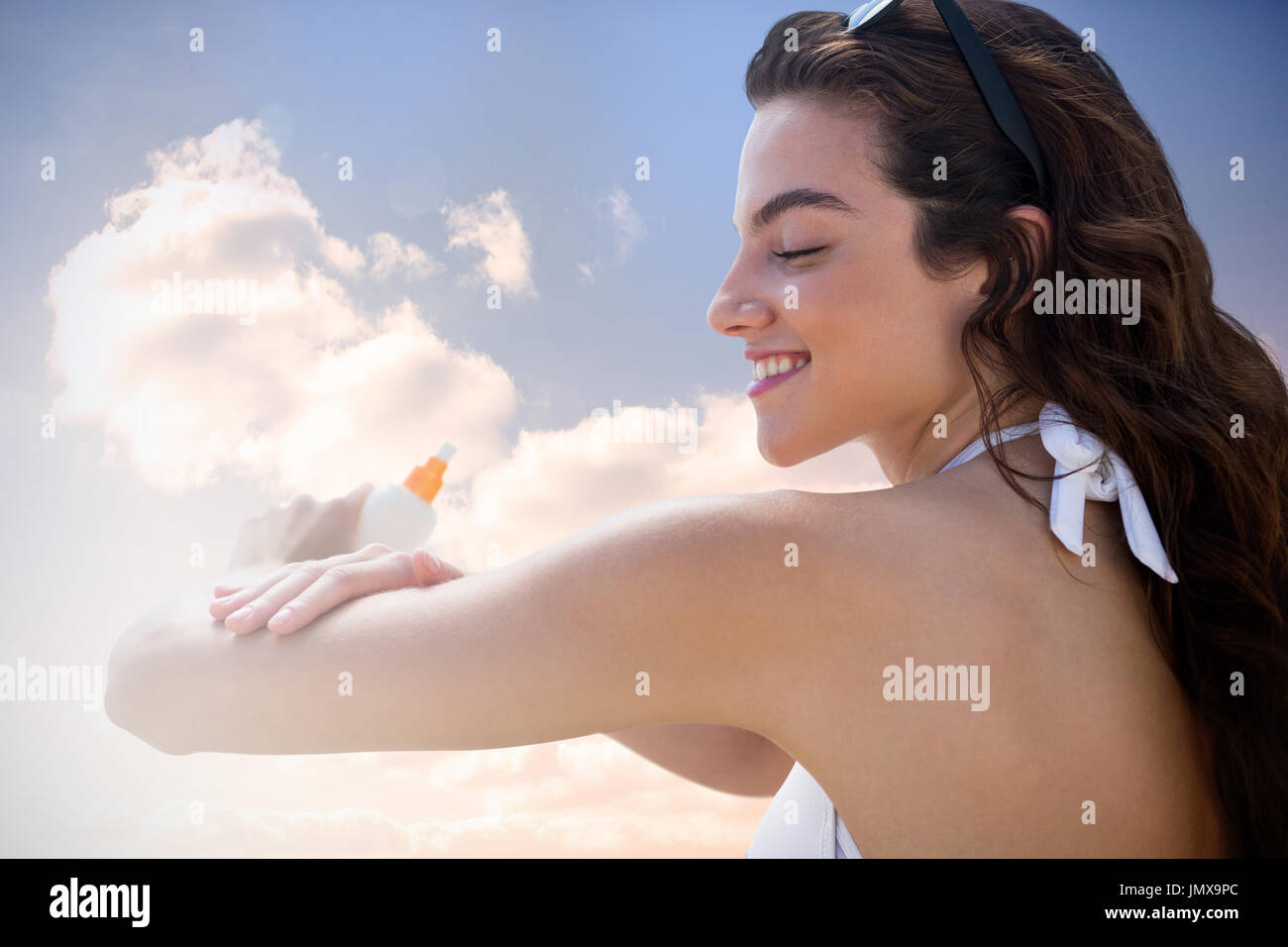 Caucasian woman applying suncream hi-res stock photography and images ...