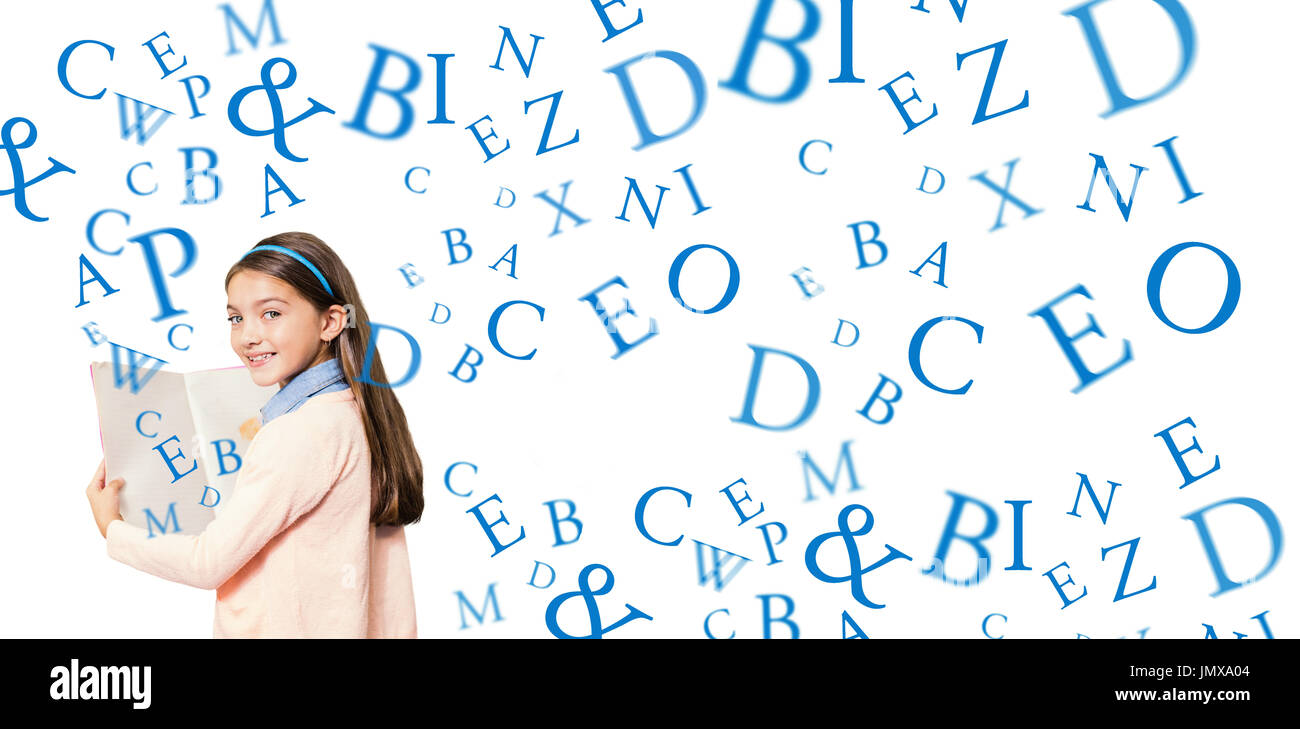 Portrait of smiling girl holding book against letters on a white ...