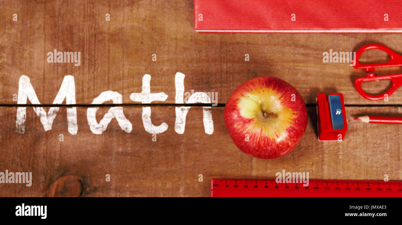 Math text on white background against overhead view of apple with ruler ...