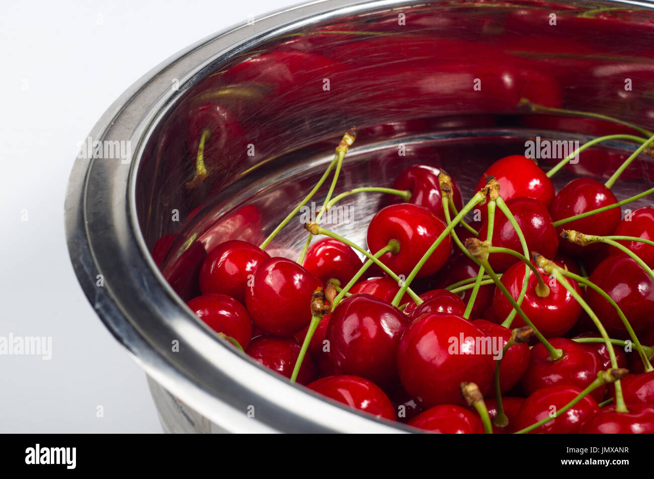 large ripe red cherries in a dish of stainless steel, close-up Stock ...