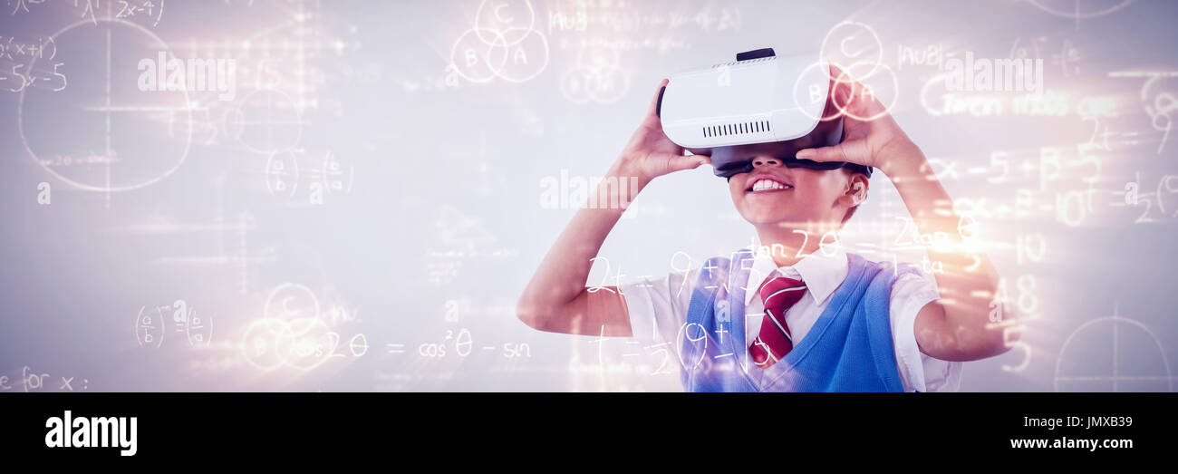 Mathematical equations solved on blackboard against schoolboy using ...