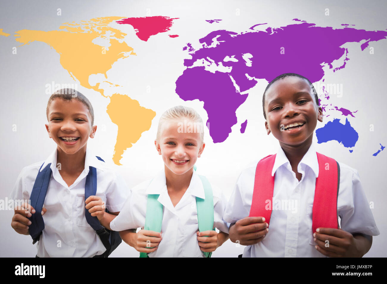Portrait of happy students in uniforms against grey background Stock ...