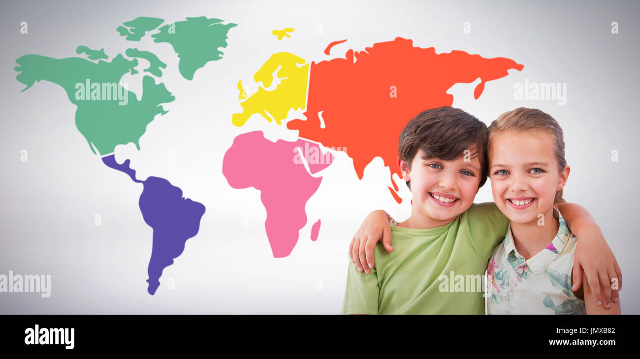 Portrait of happy siblings against grey background Stock Photo - Alamy