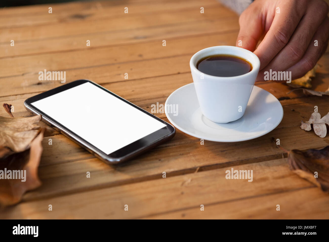 Close-up of man hand having a cup of black coffee Stock Photo - Alamy