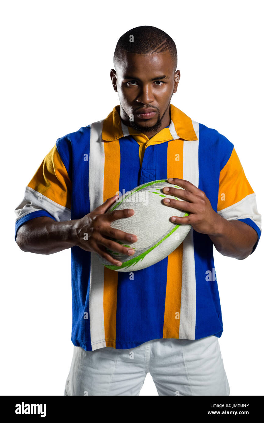 Confident male rugby player standing against white background Stock ...