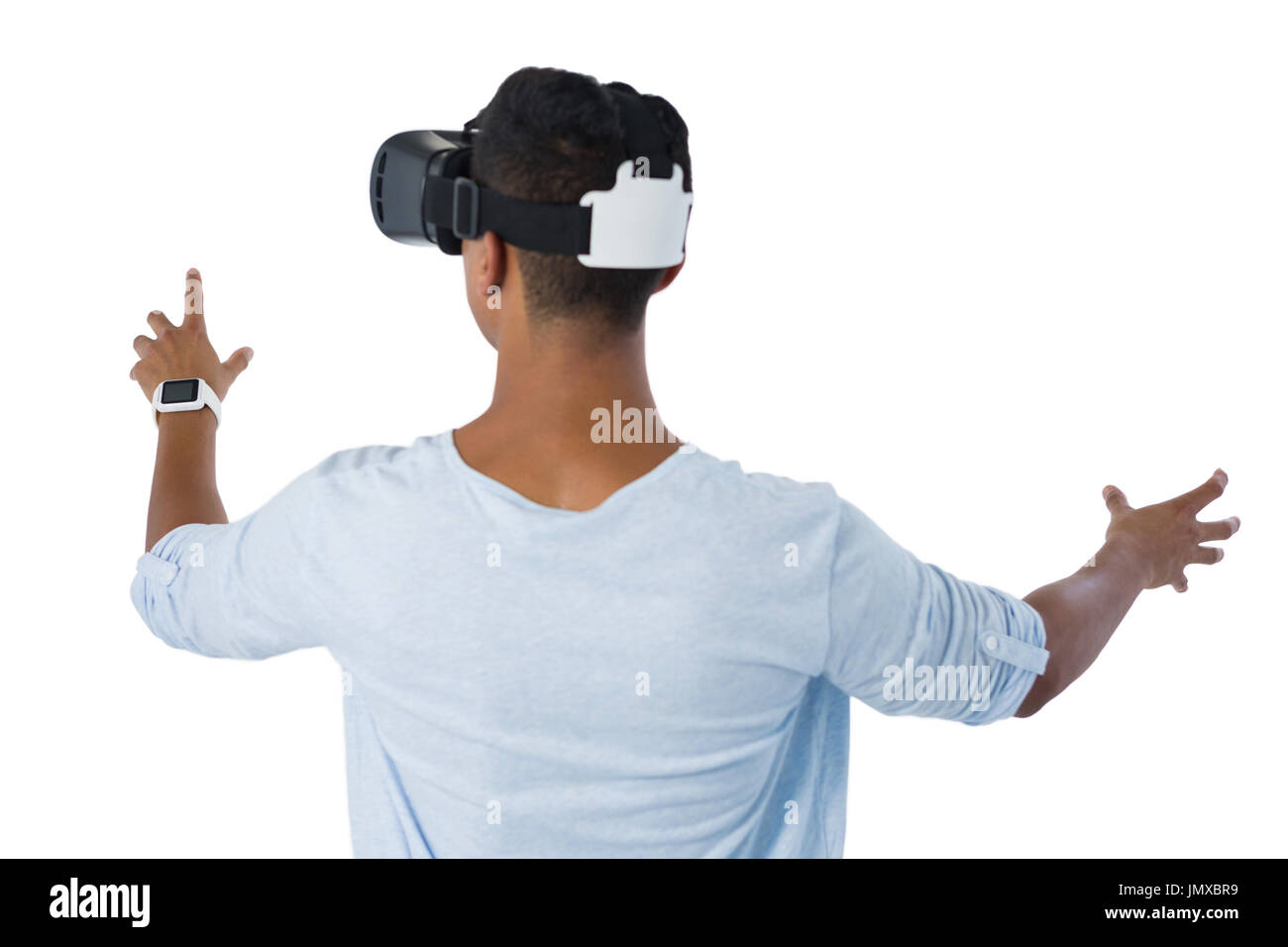 Rear view of man using virtual reality headset against white background ...