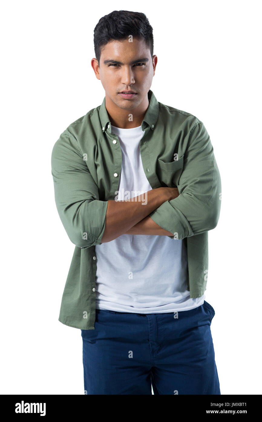 Portrait of confident man standing with arms crossed on white ...