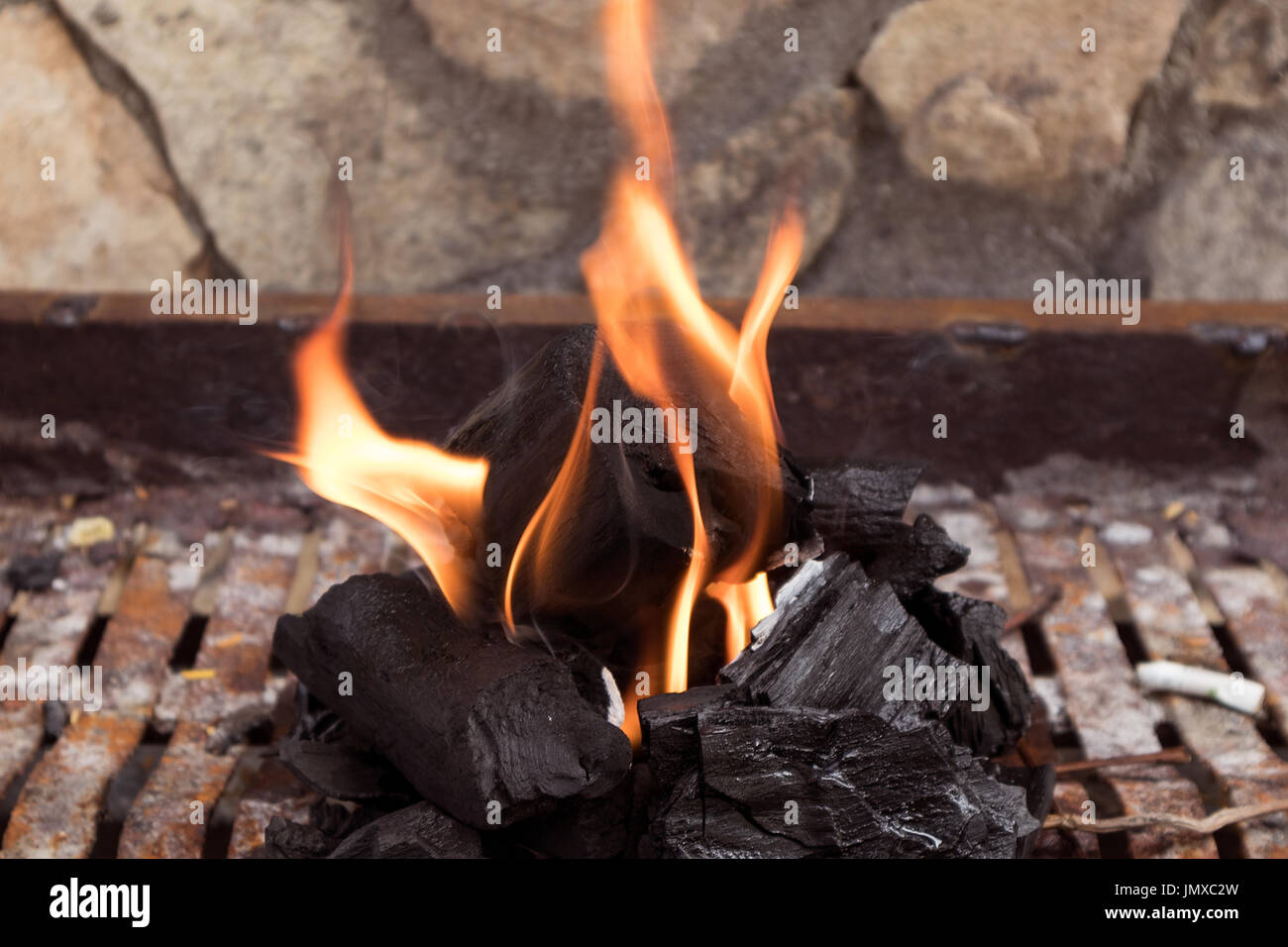 Pieces of burning coal Stock Photo - Alamy