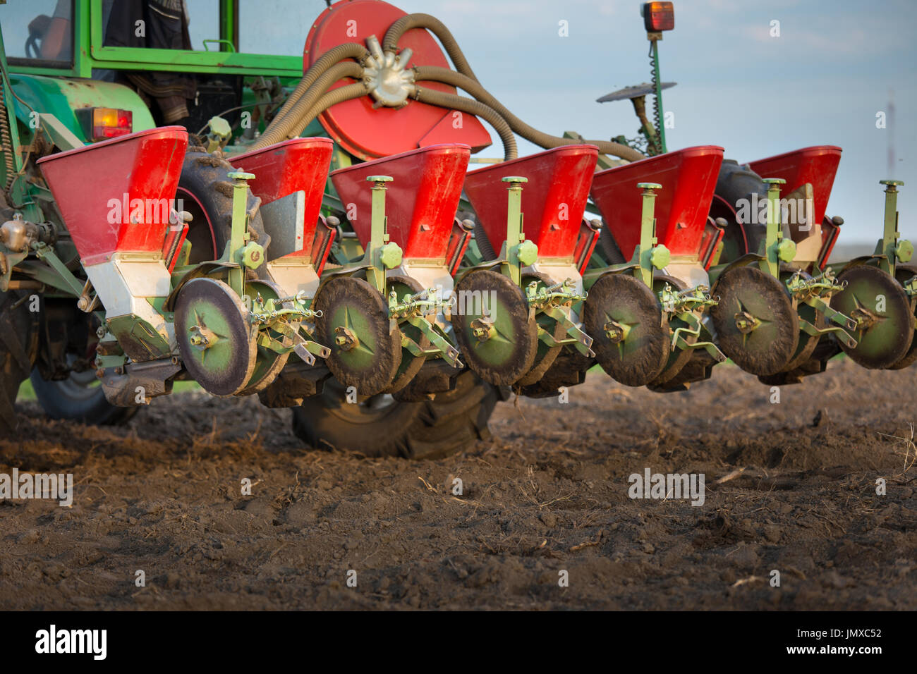 Tractor sowing seeds seed drill hi-res stock photography and images - Alamy