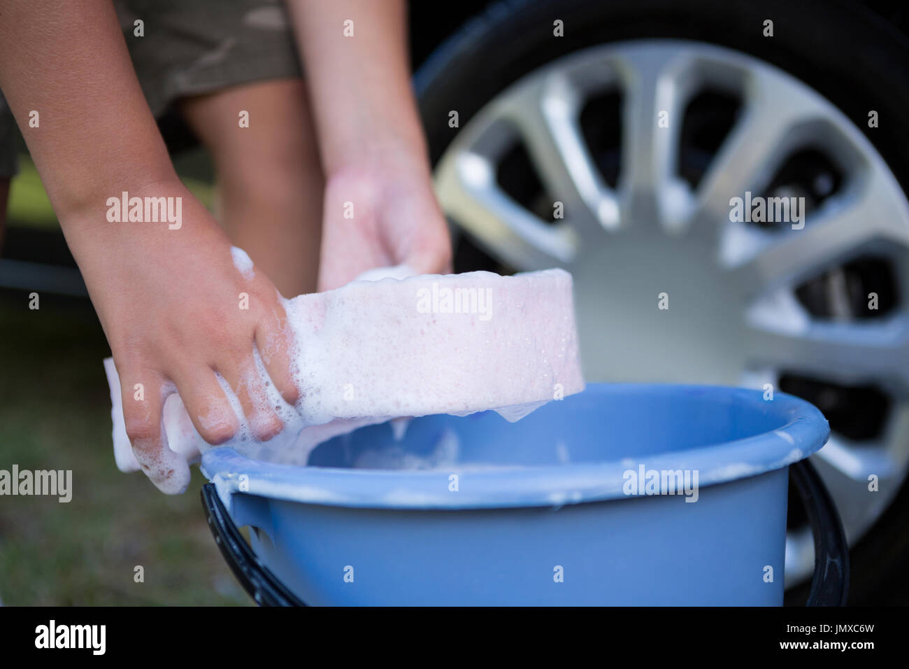 Teenage boy washing car hi-res stock photography and images - Alamy