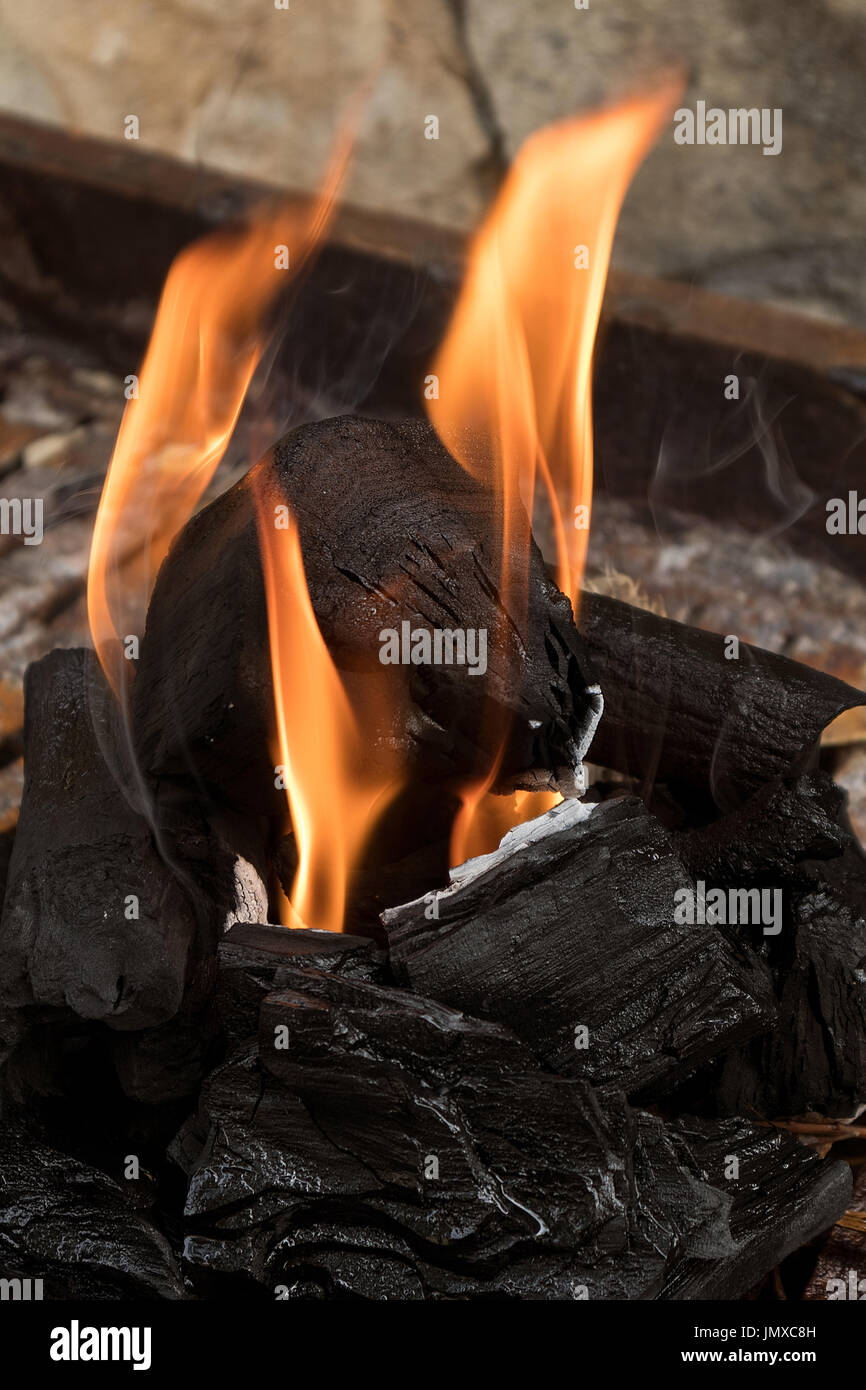 Pieces of burning coal Stock Photo - Alamy