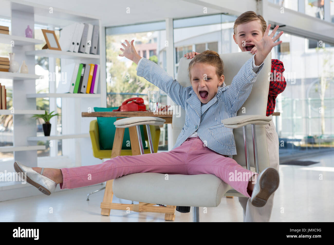 Girl pushing chair hi-res stock photography and images - Alamy