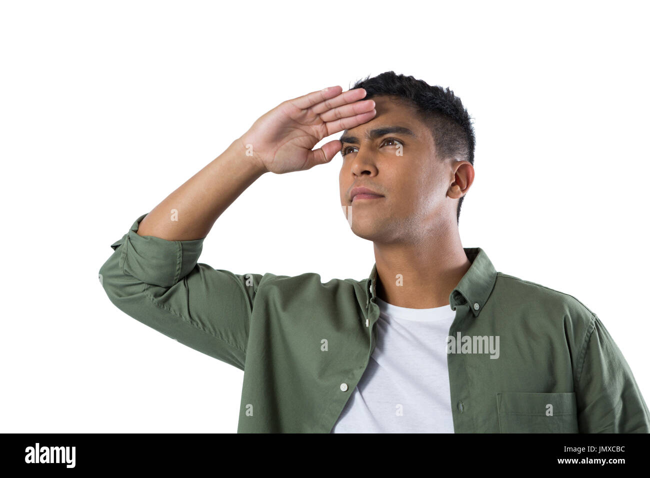 Handsome man shielding eyes against white background Stock Photo - Alamy