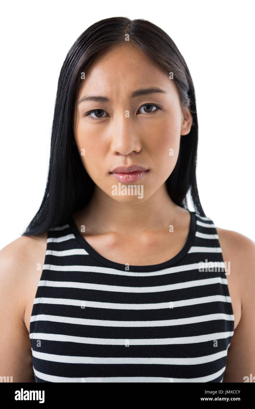 Portrait of depressed woman standing against white background Stock ...