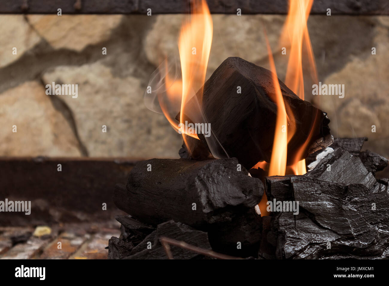 Pieces of burning coal Stock Photo - Alamy