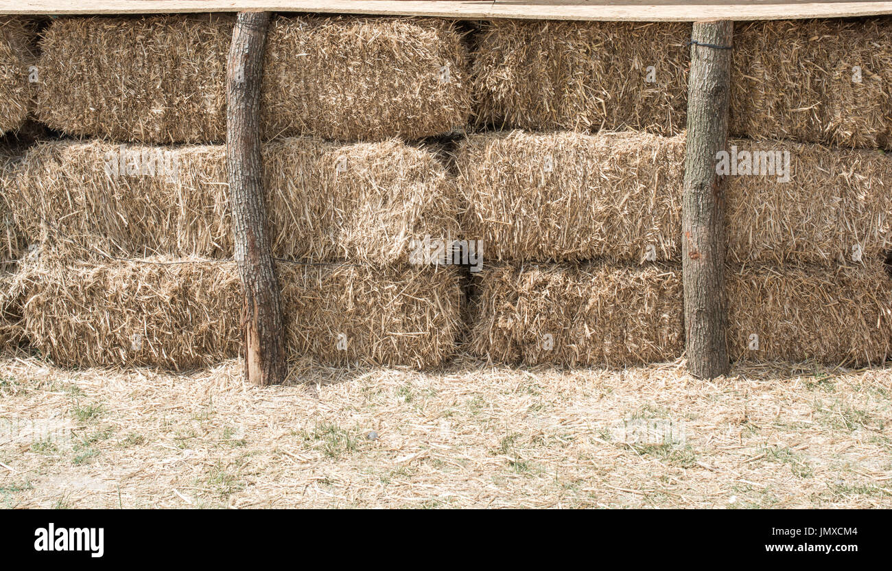 Hay bales stacks outdoors Stock Photo - Alamy