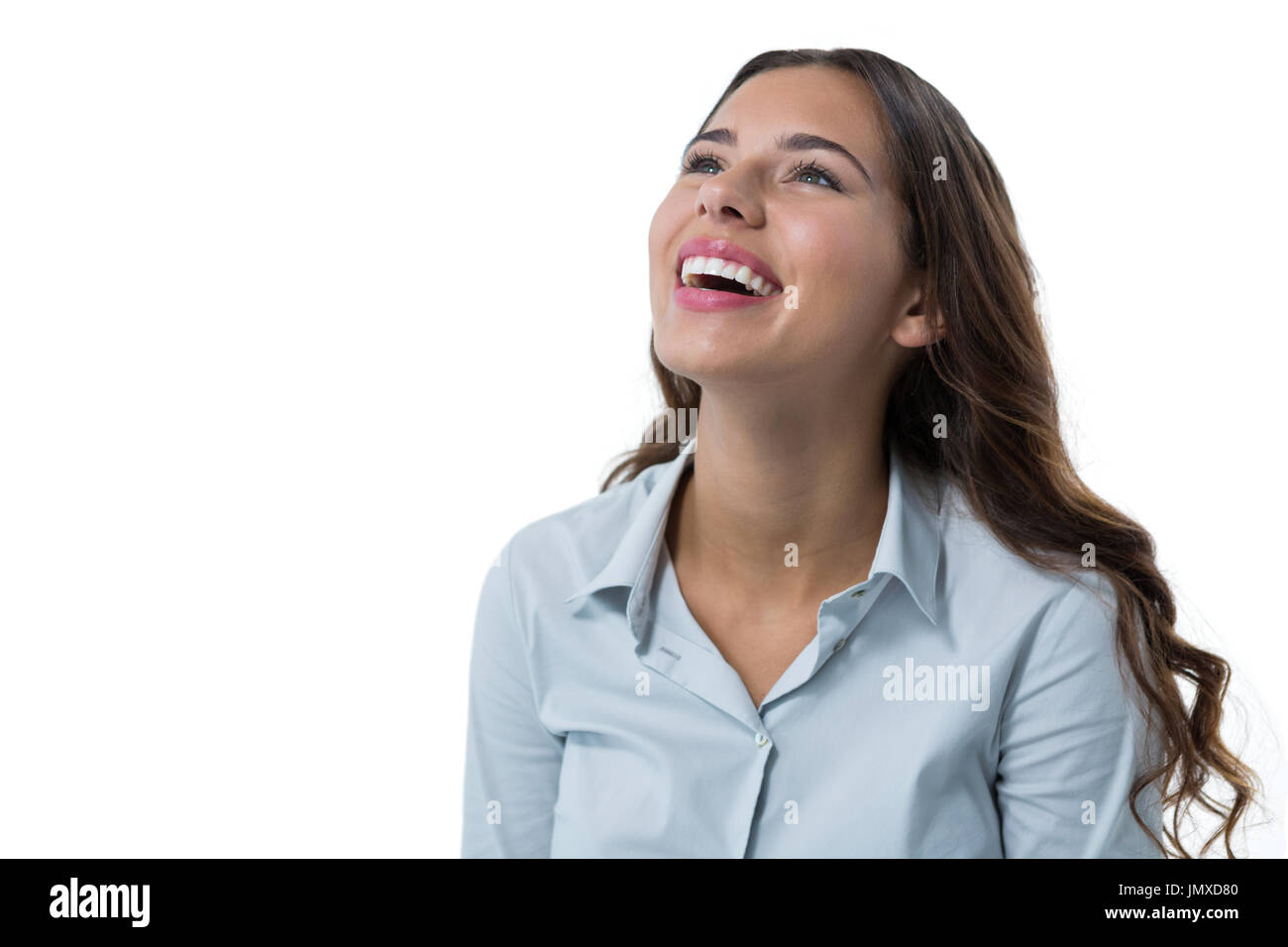 Beautiful female executive smiling against white background Stock Photo ...