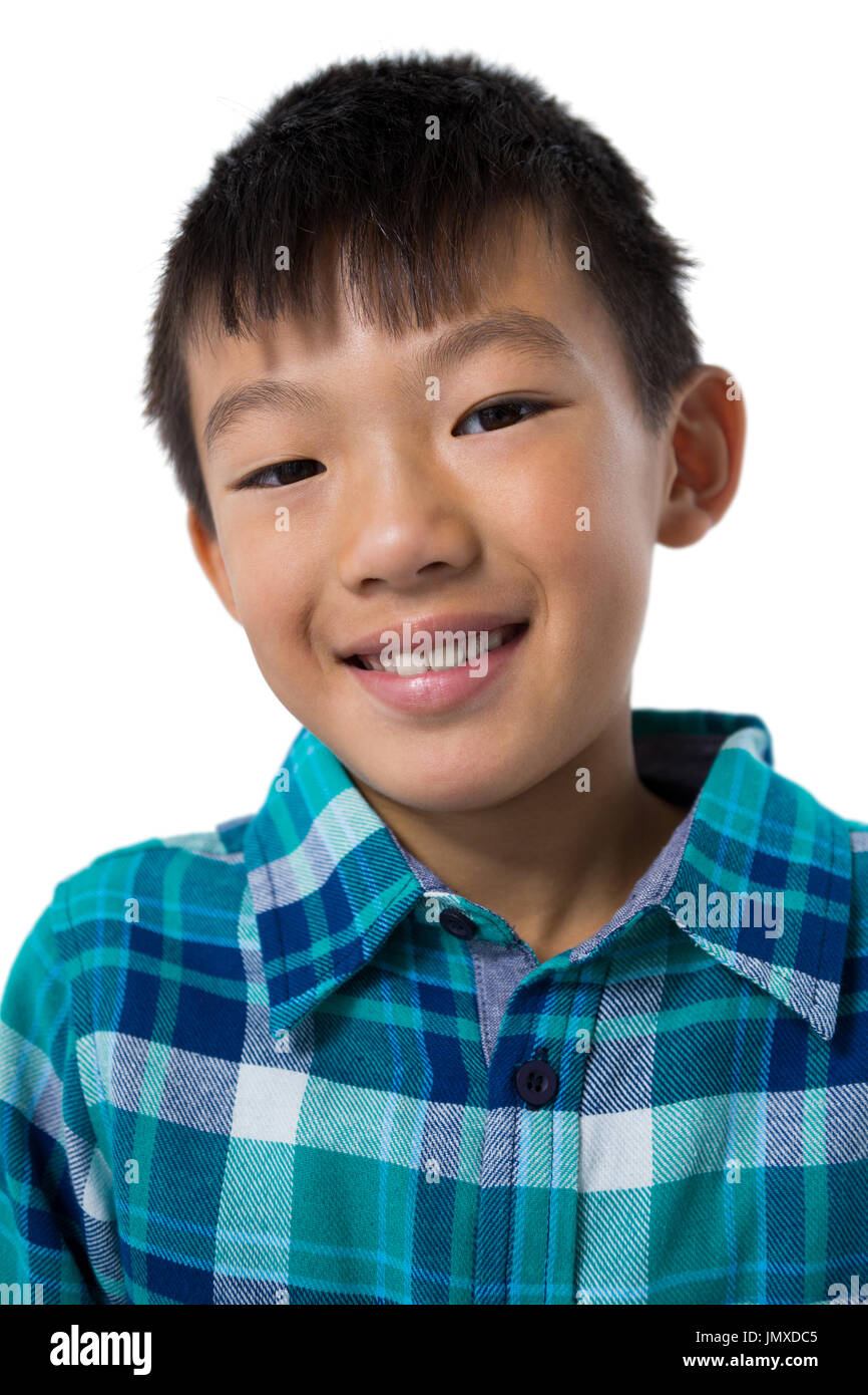 Portrait of boy smiling against white background Stock Photo - Alamy