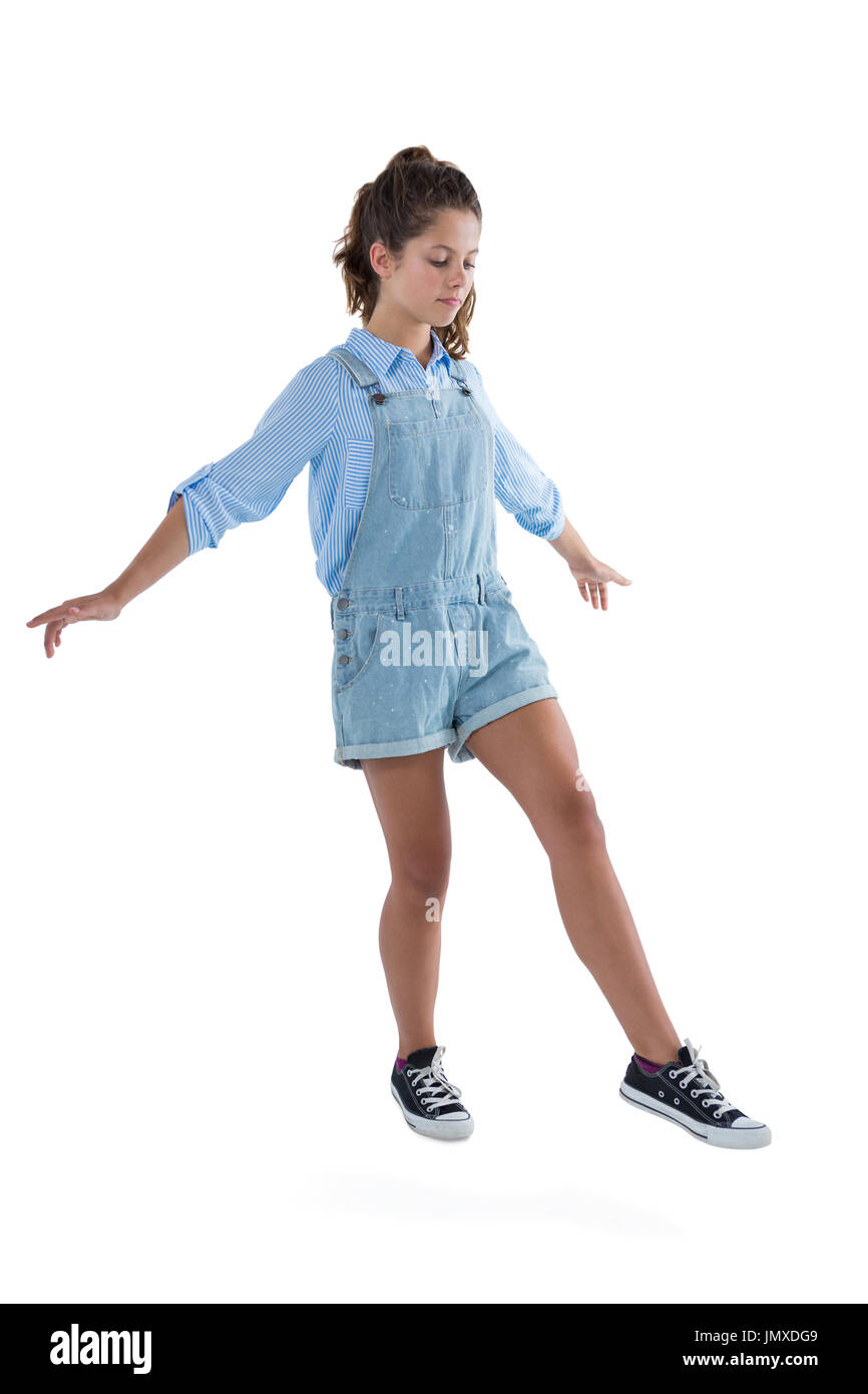 Confident teenage girl posing on white background Stock Photo - Alamy