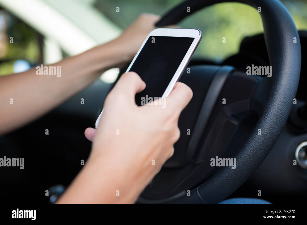 Using mobile phone while driving hi-res stock photography and images ...