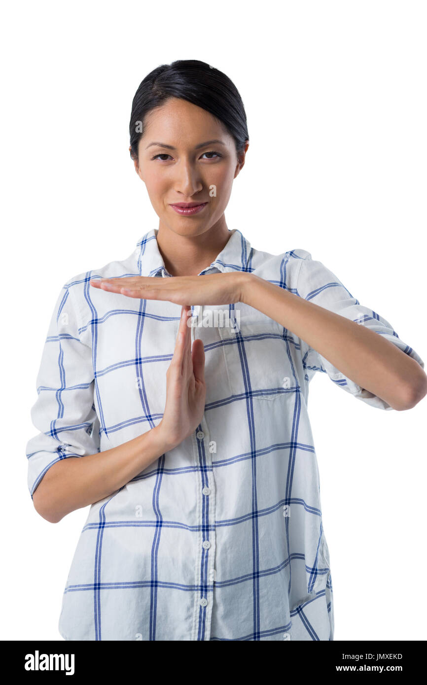 Portrait of woman making a timeout hand gesture Stock Photo - Alamy