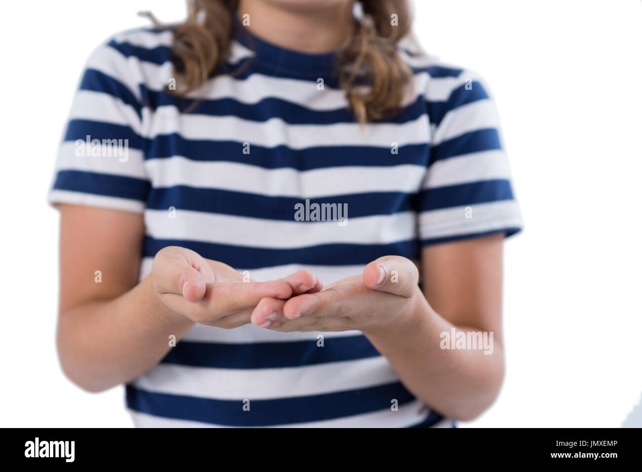 Mid section of girl pretending to be holding invisible object against ...