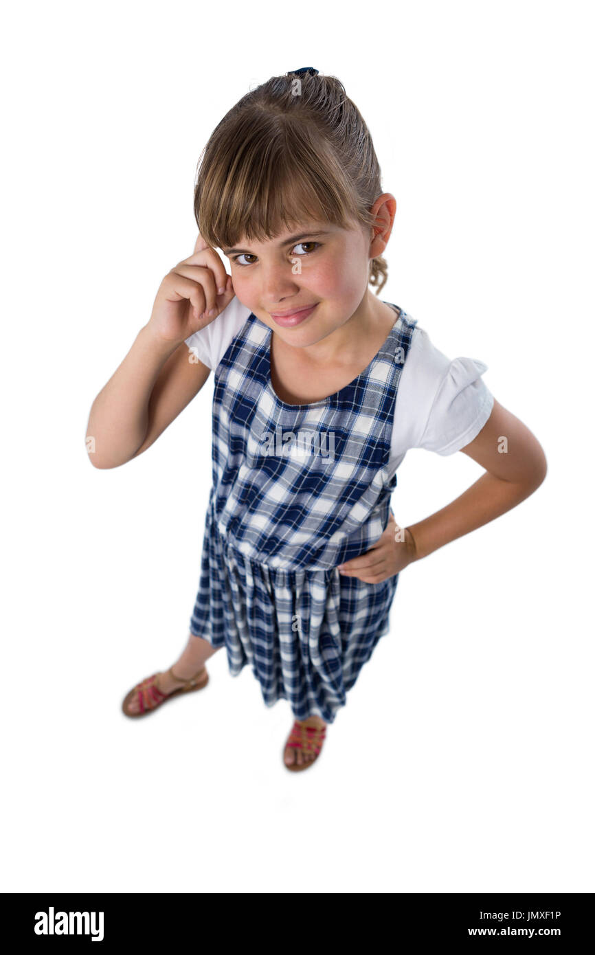 Overhead view of cute girl posing on white background Stock Photo - Alamy