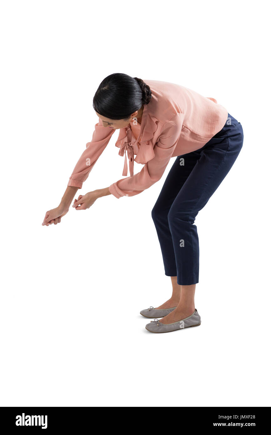 Female executive pretending to be holding invisible object on white ...