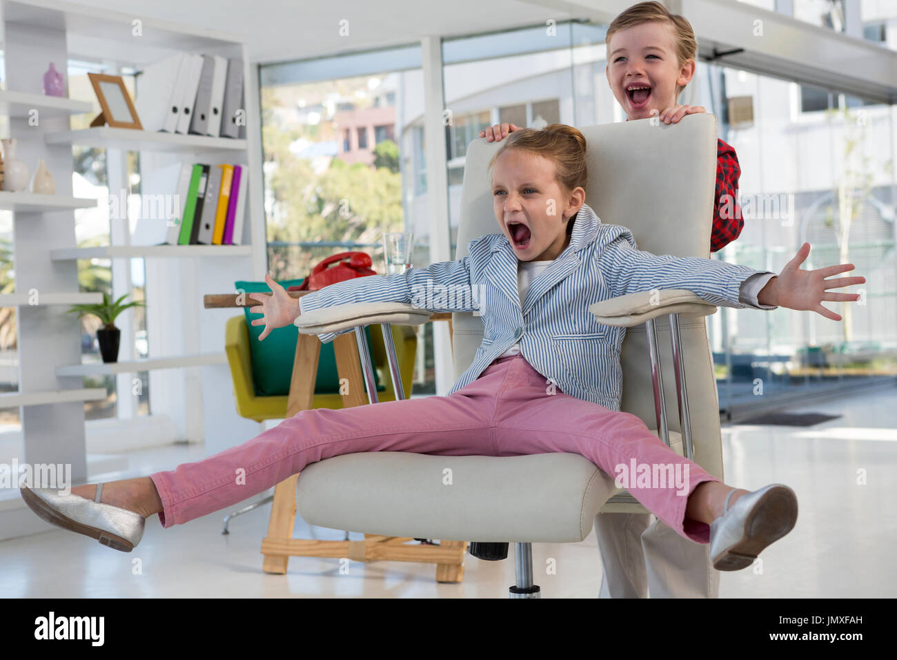 Girl pushing chair hi-res stock photography and images - Alamy