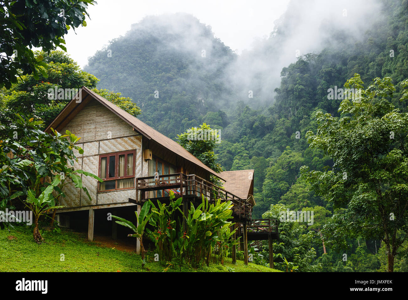 Wooden house in tropical forest Stock Photo - Alamy