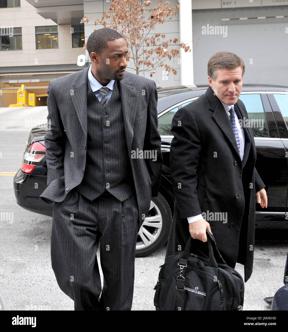 Washington Wizards guard Gilbert Arenas, left, arrives with his ...