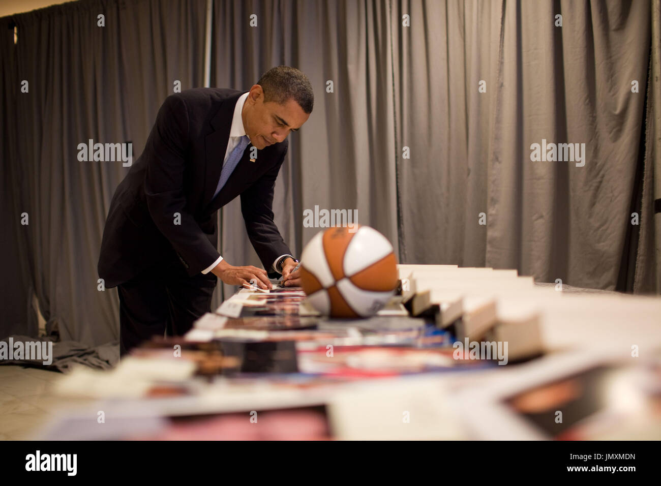 United States President Barack Obama signs pictures and other items in ...