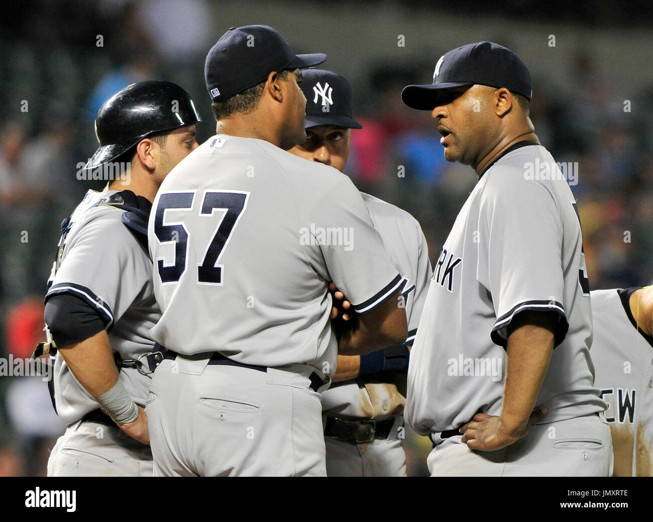 New York Yankees acting pitching coach Mike Harkey (57) visits pitcher ...