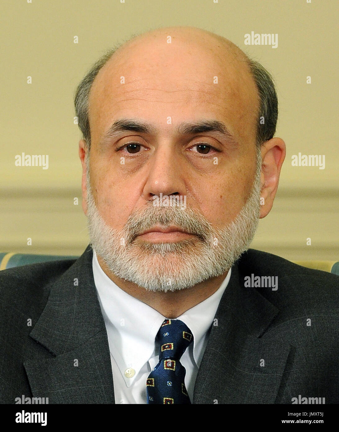 Federal Reserve Board Chairman Ben Bernanke looks on as United States ...