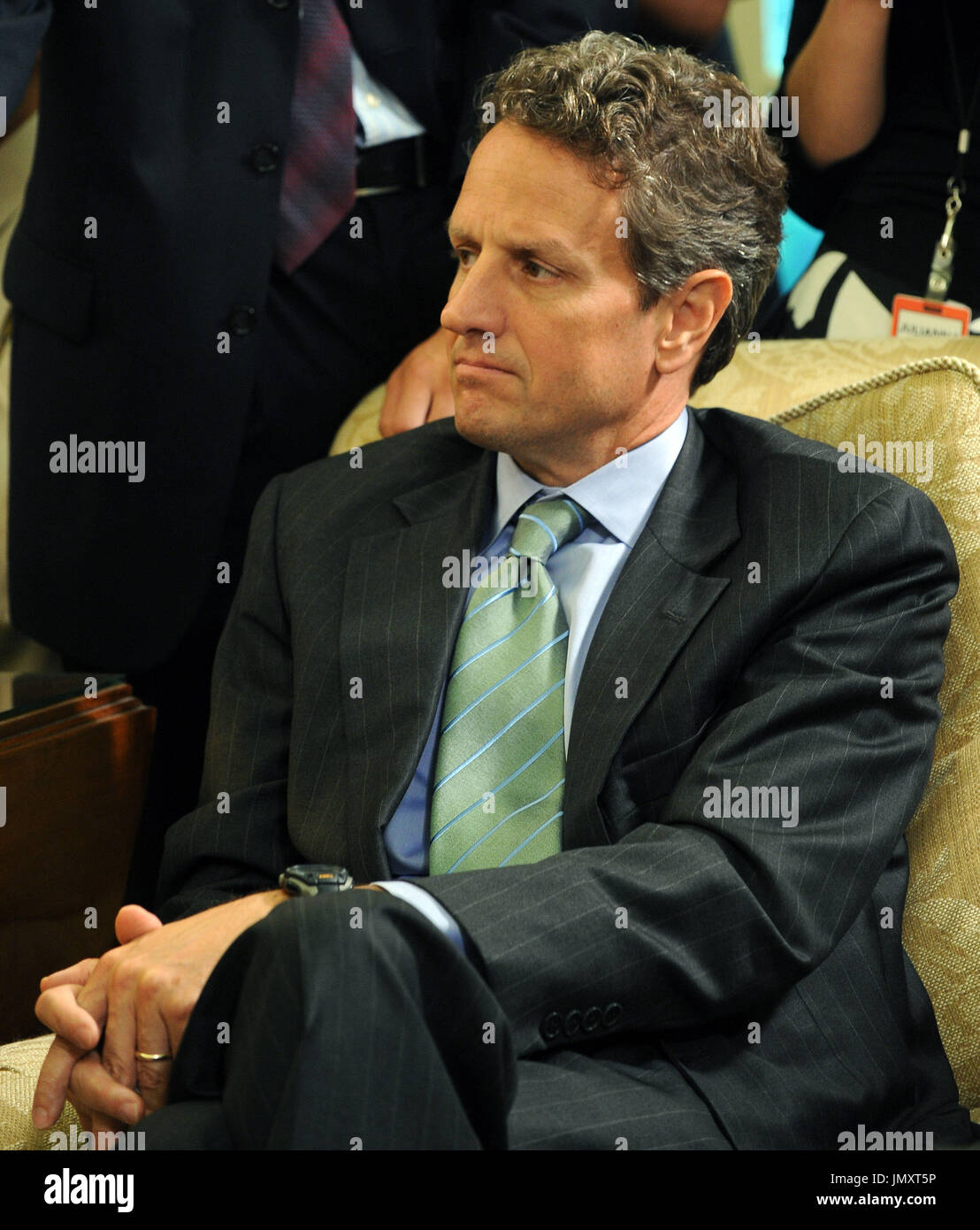 United States Secretary of the Treasury Timothy Geithner looks on as U ...