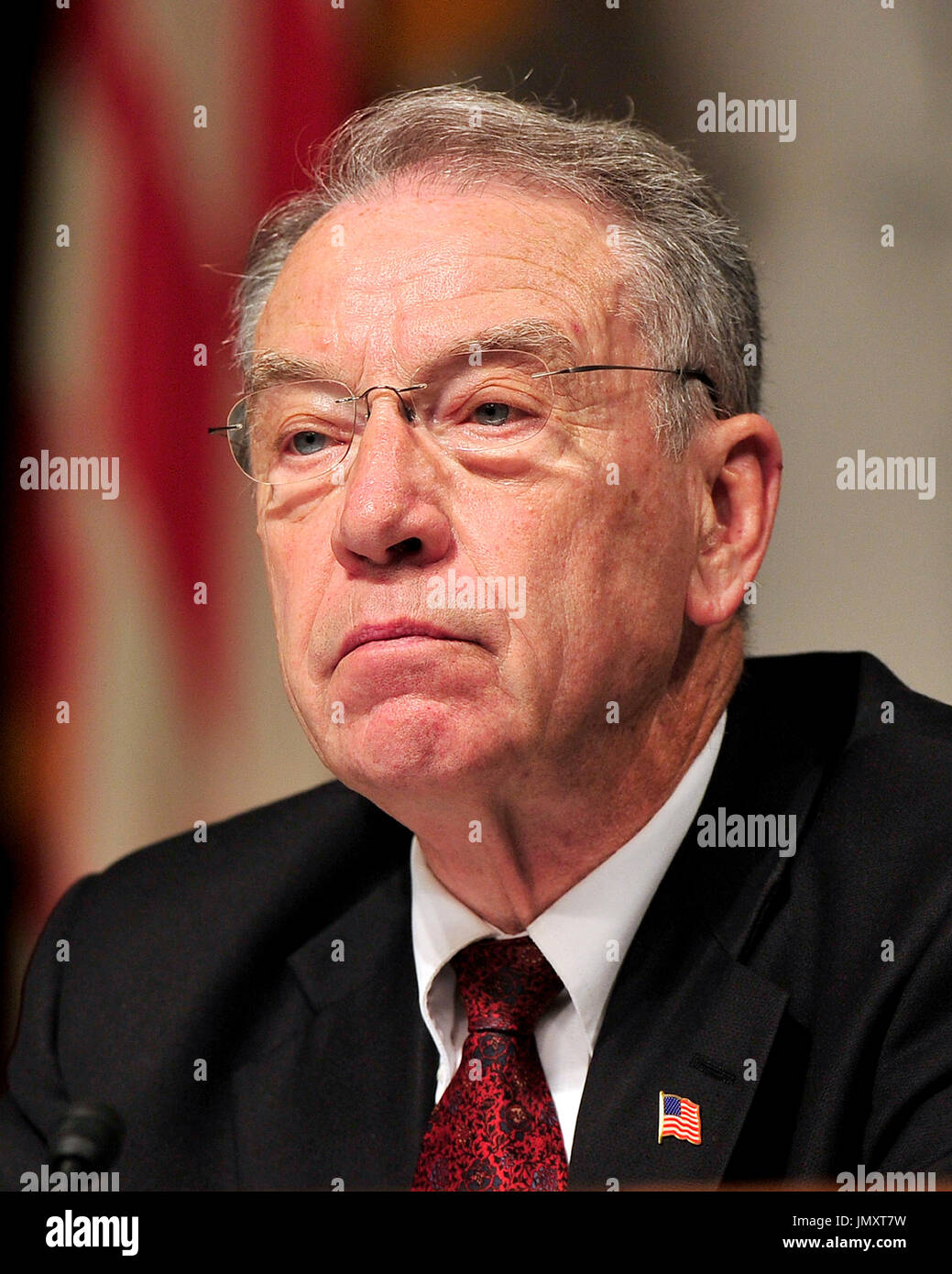 United States Senator Chuck Grasley (Republican of Iowa) listens to the ...