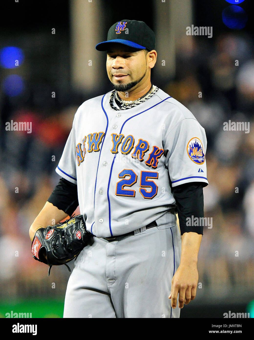 New York Mets pitcher Pedro Feliciano (25) winces after loading the ...