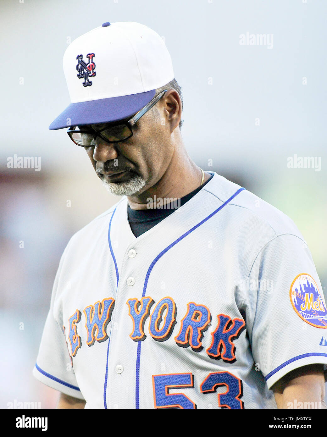 New York Mets manager Jerry Manuel dejectedly returns to the dug-out ...