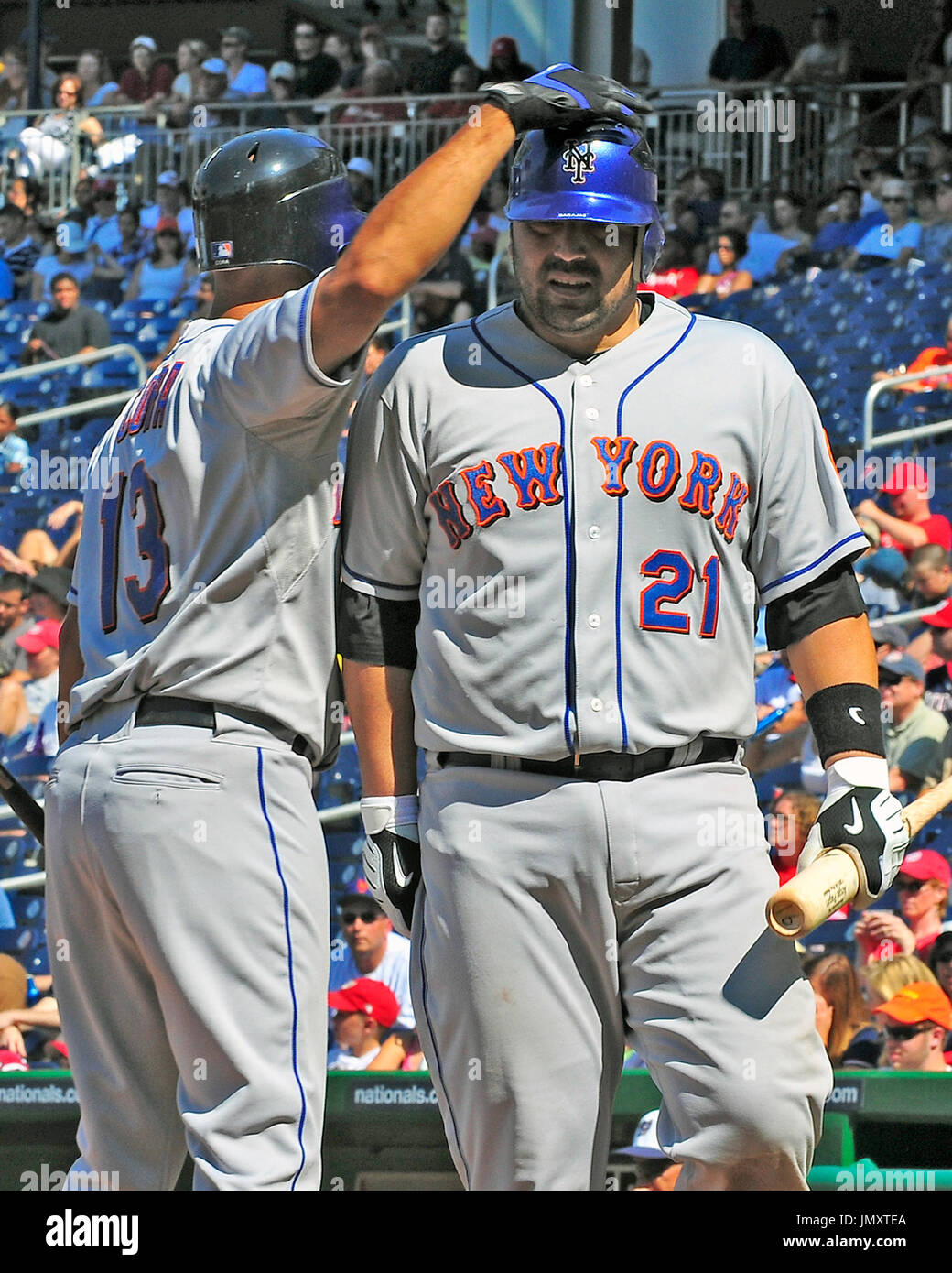New York Mets second baseman Alex Cora (13) congratulates catcher Rod ...