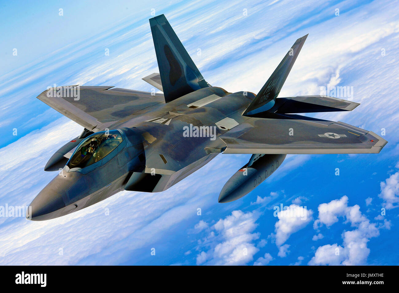An F-22 Raptor soars through the skies on its way to Joint Base Pearl ...