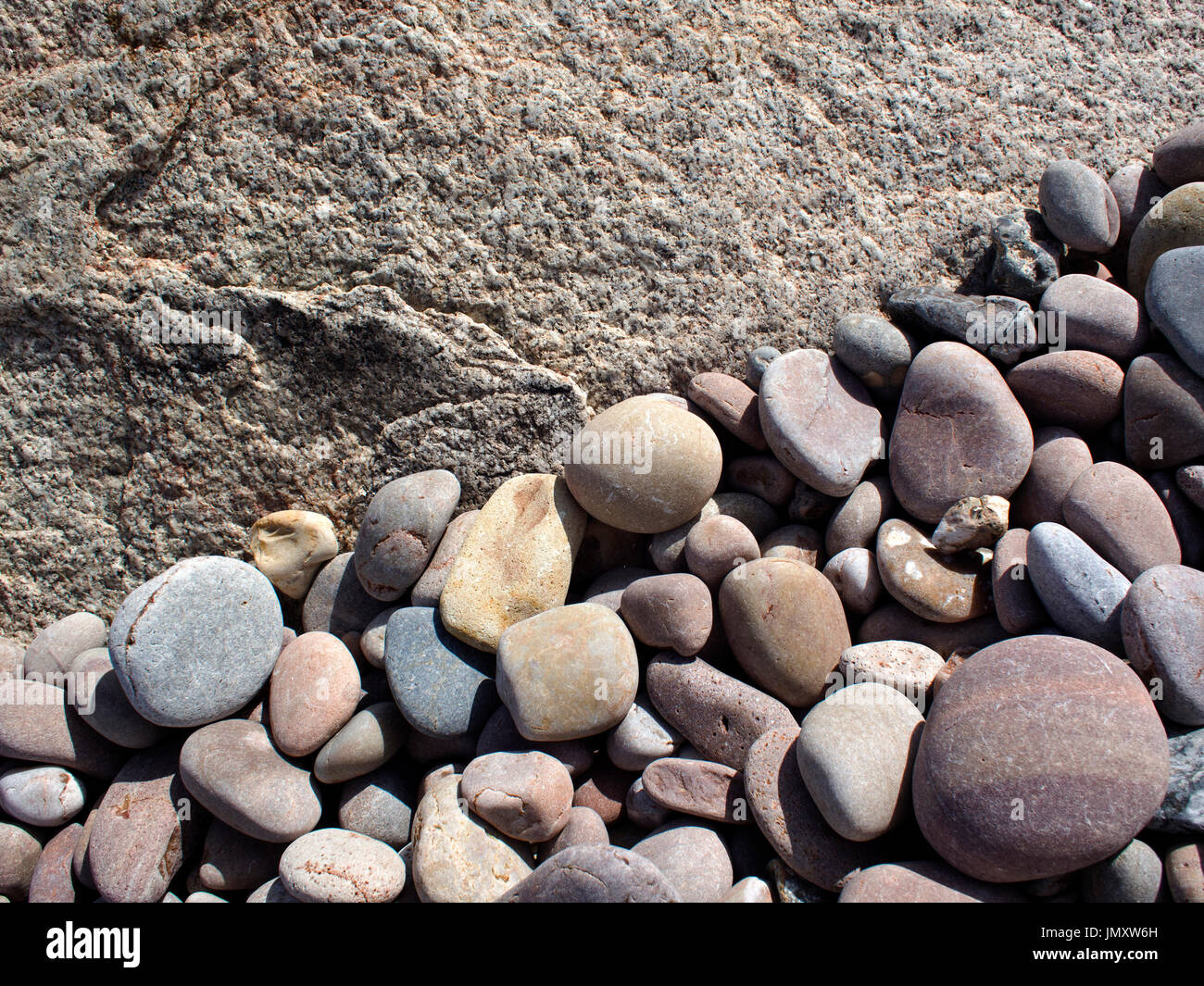 Worn and rounded pebbles forming interesting patterns in the gaps ...