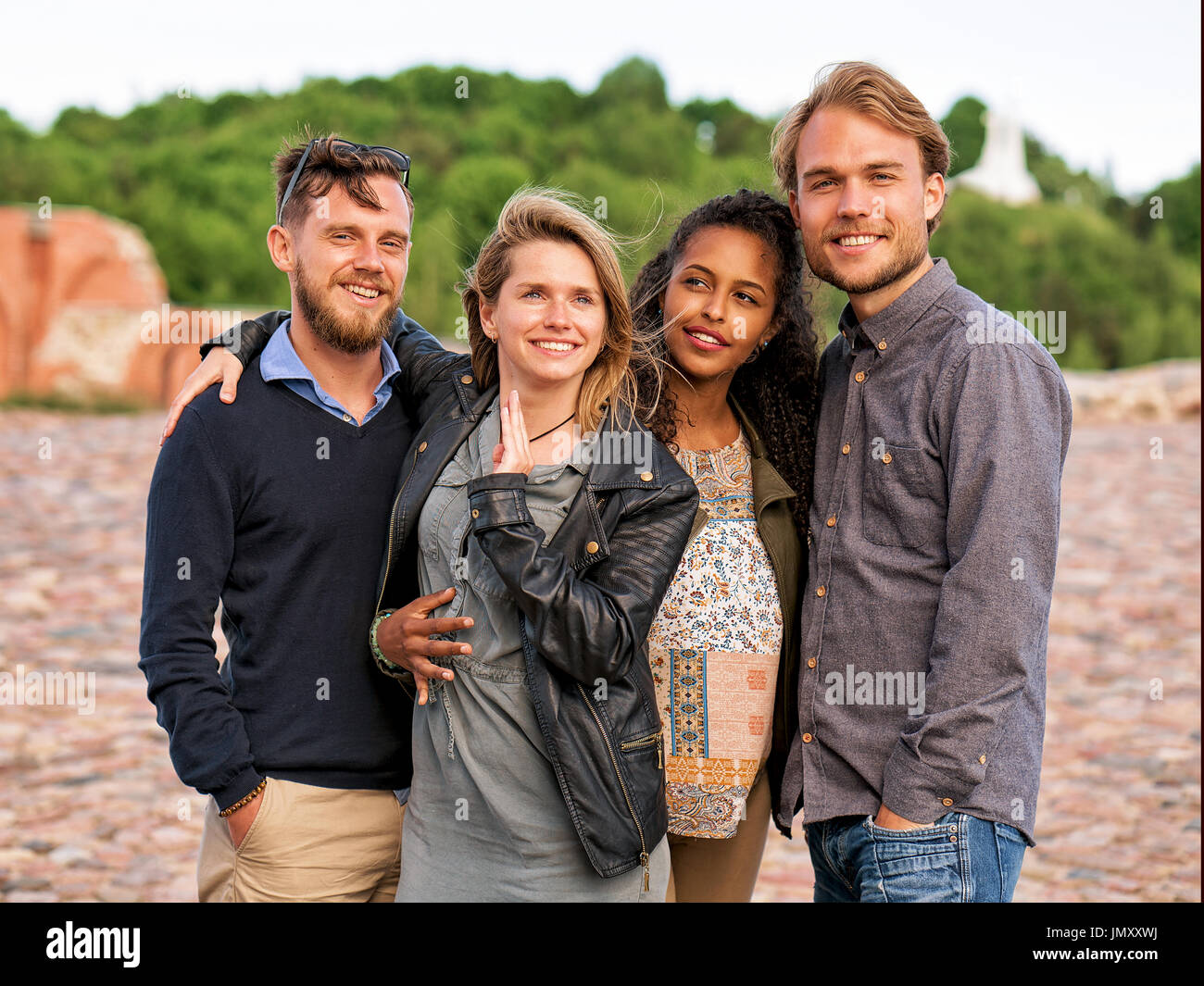 Group friends standing close other hi-res stock photography and images ...