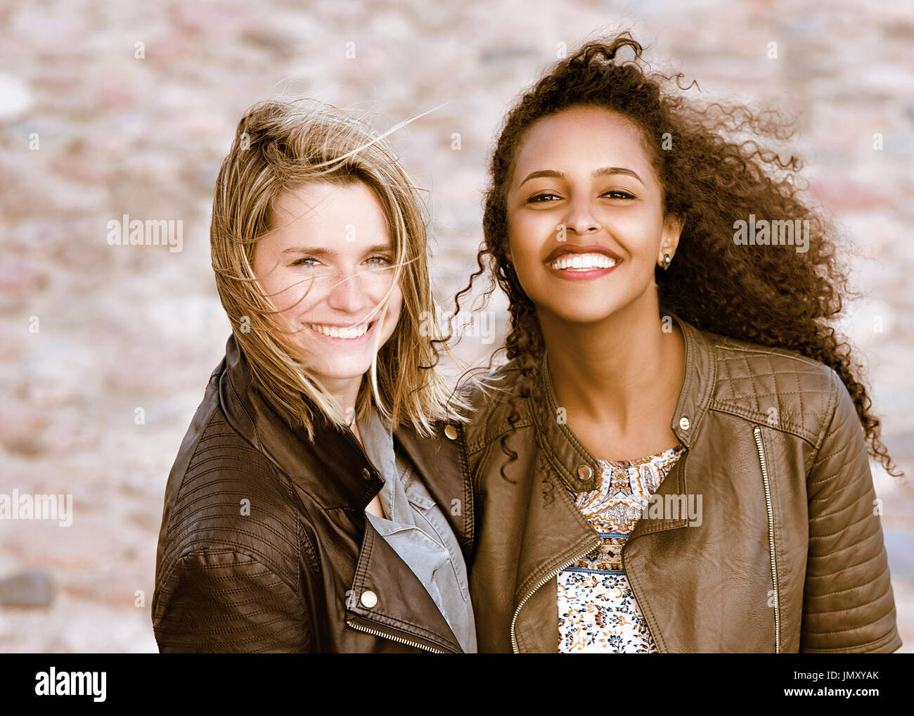 Happy caucasian and middle eastern female friends, as diversity ...