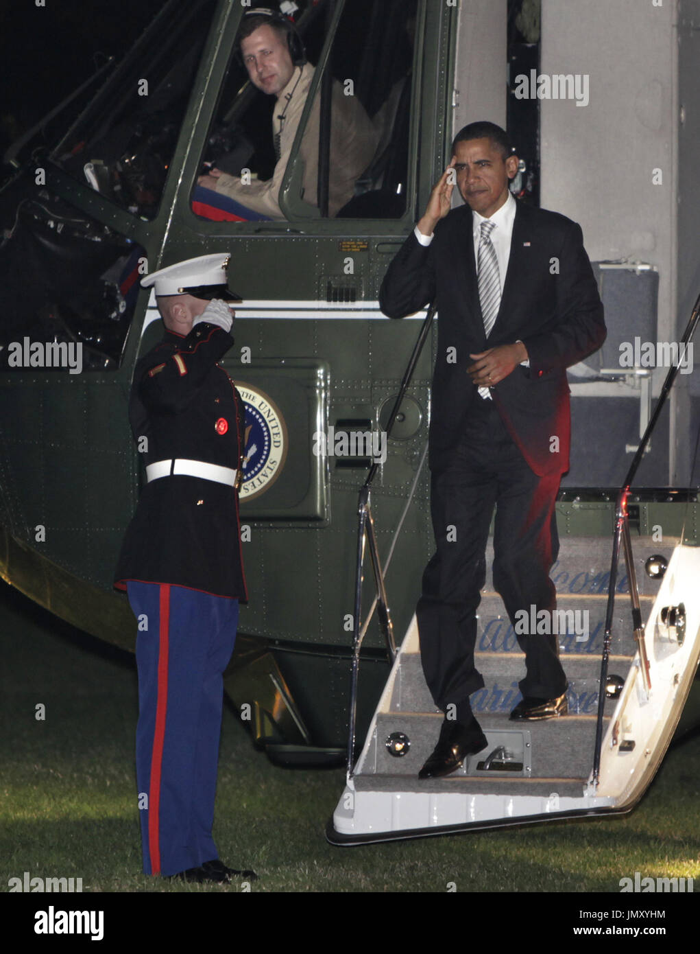 United States President Barack Obama salutes from the steps of the ...
