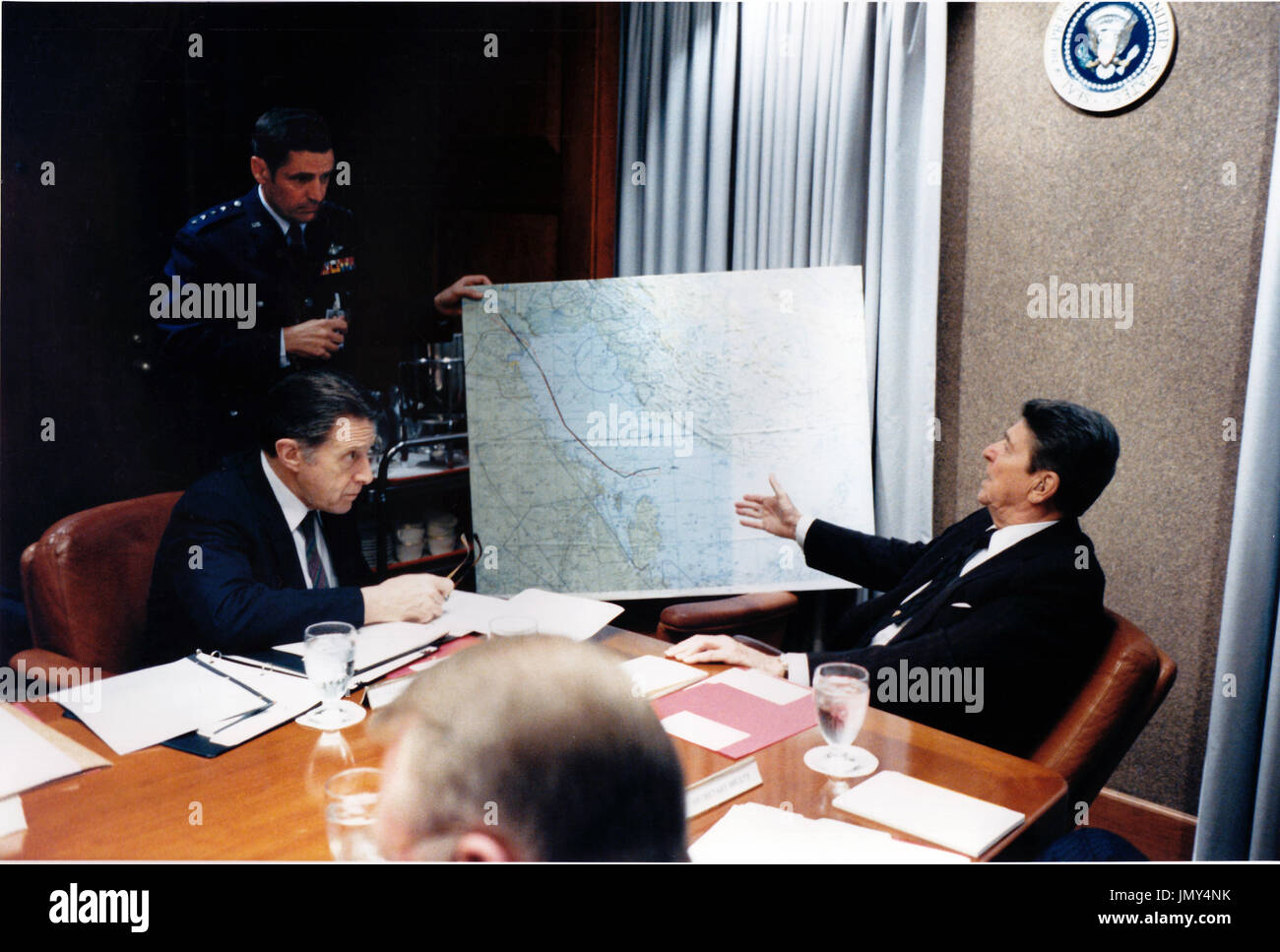 United States President Ronald Reagan asks a question during a ...