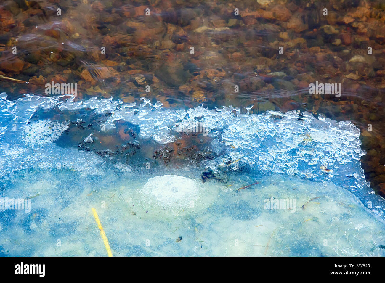 Melting spring ice on river filled with light and colors Stock Photo ...