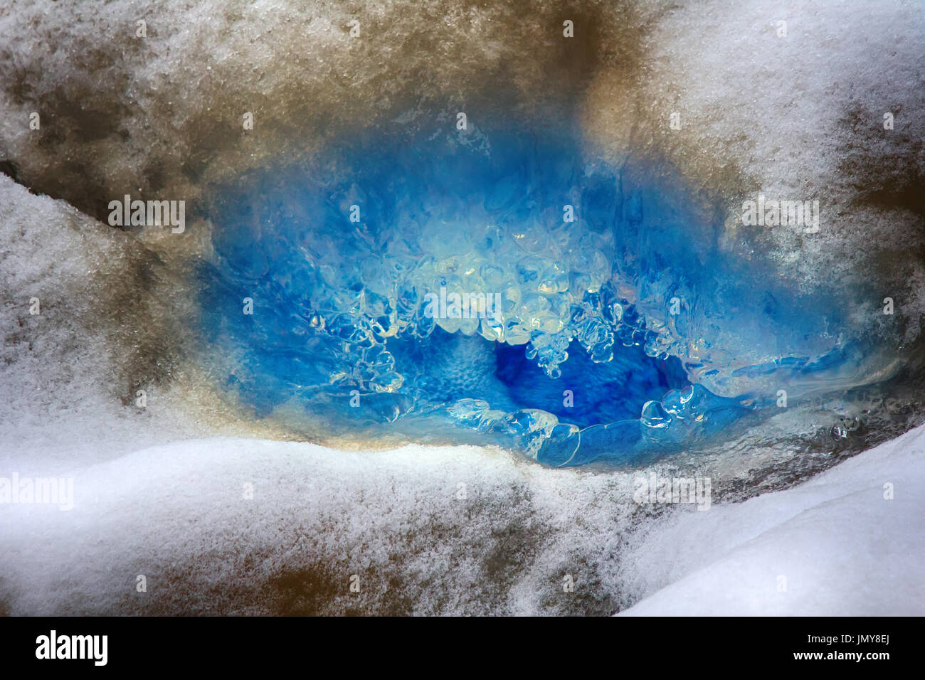 Unity of opposites. Combination of dirty and crystal clear blue ice ...